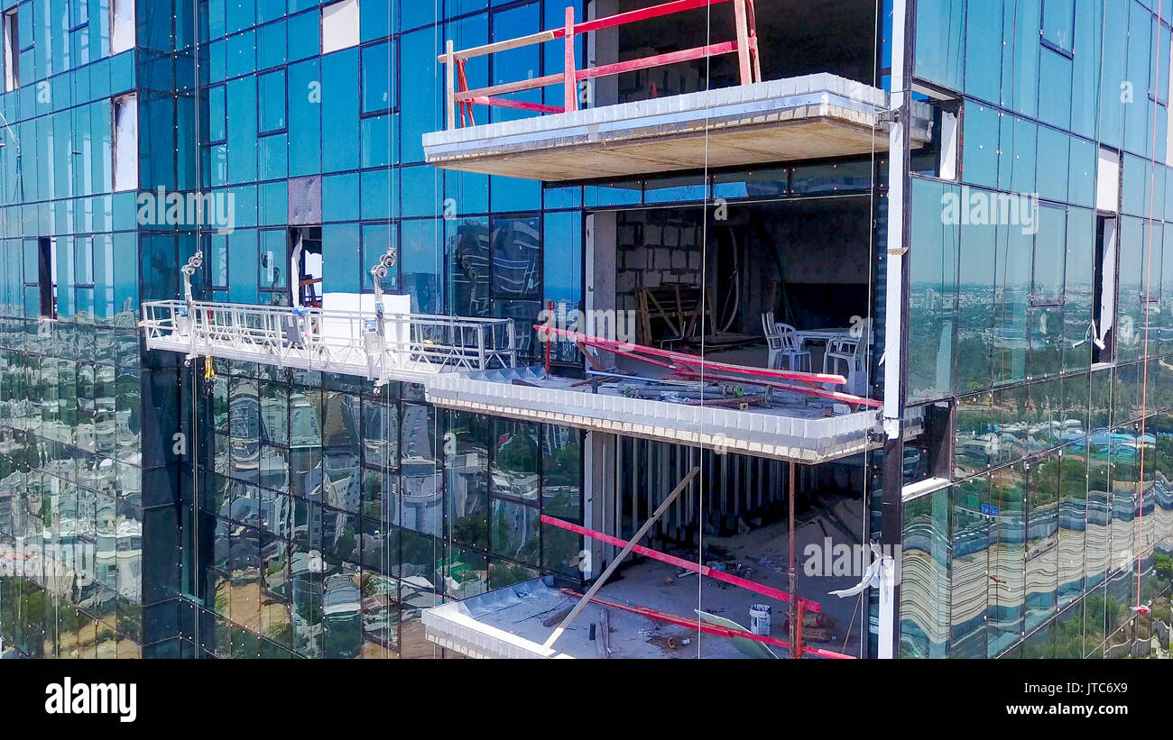 New Skyscraper building in final construction stage Stock Photo - Alamy