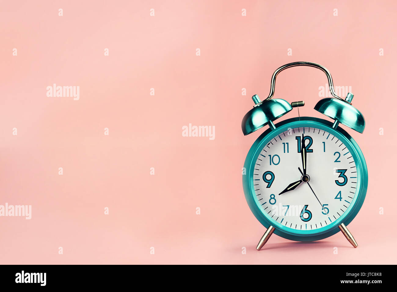 Vintage style alarm clock with room for copy space Stock Photo - Alamy