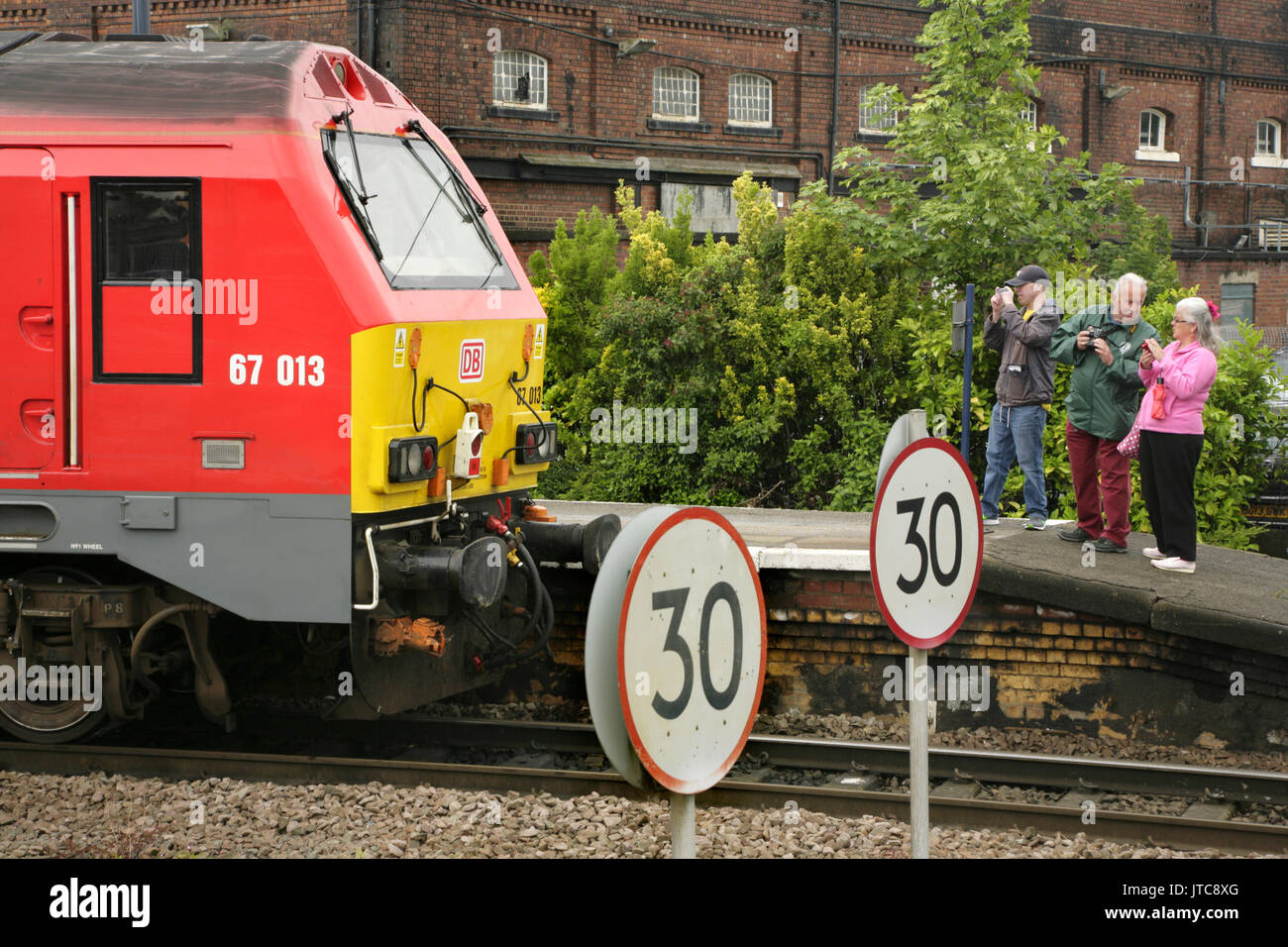 Rail enthusiasts at York station, UK with DB Schenker class 67 diesel ...