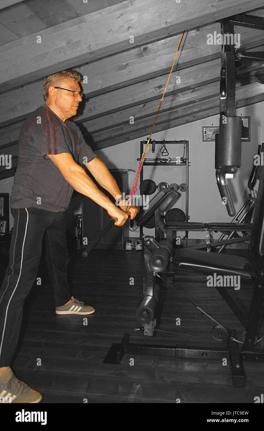 Home gym in the attic, pulleys Stock Photo - Alamy