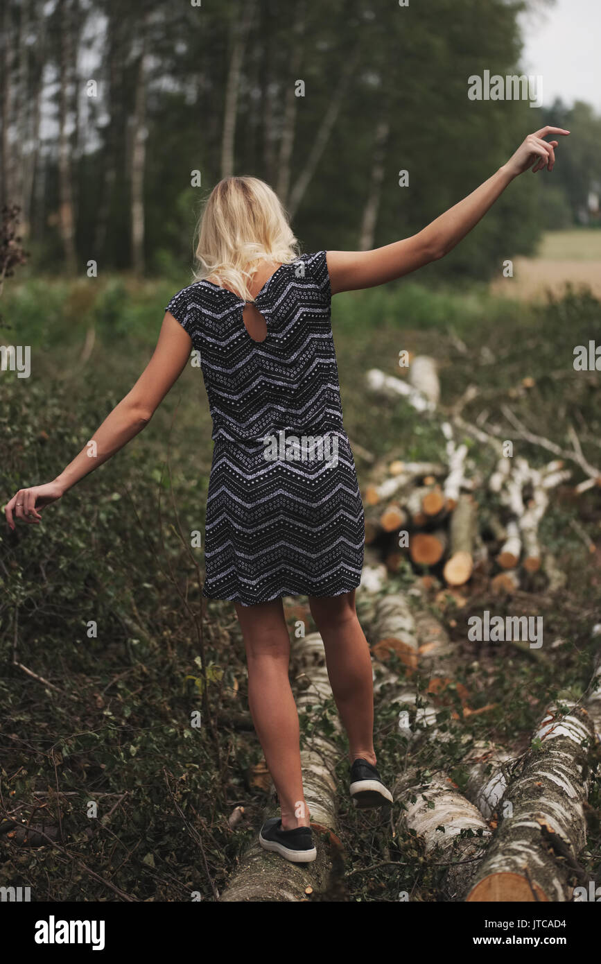 photo of beautiful girl in the felled forest Stock Photo - Alamy