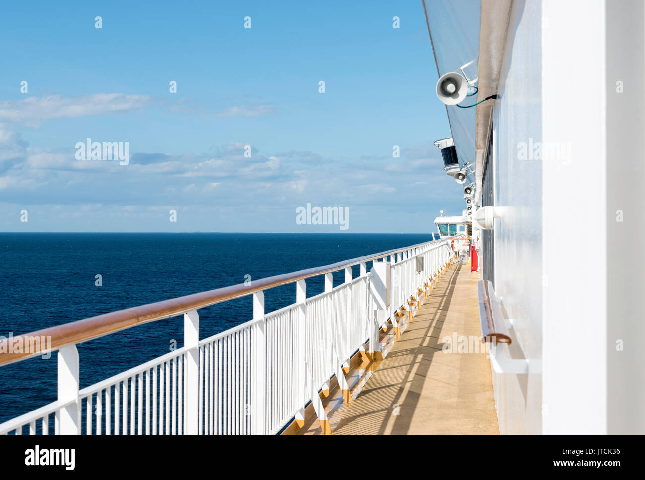travel with cruise ship over the blue sea with horizon as background ...