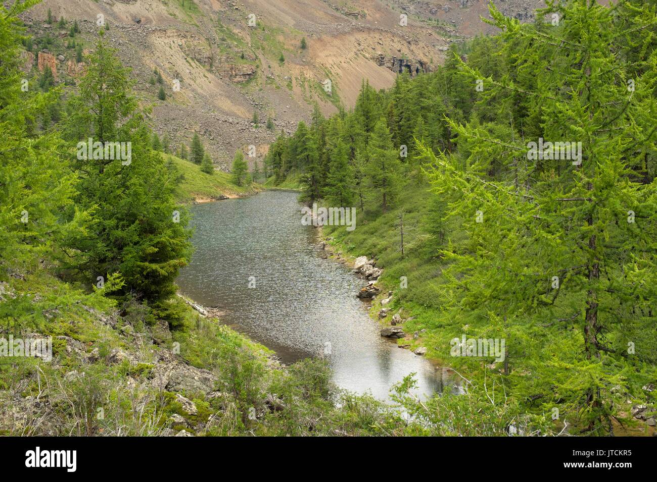 Beautiful sunny valley between mountains with lush clouds Stock Photo ...