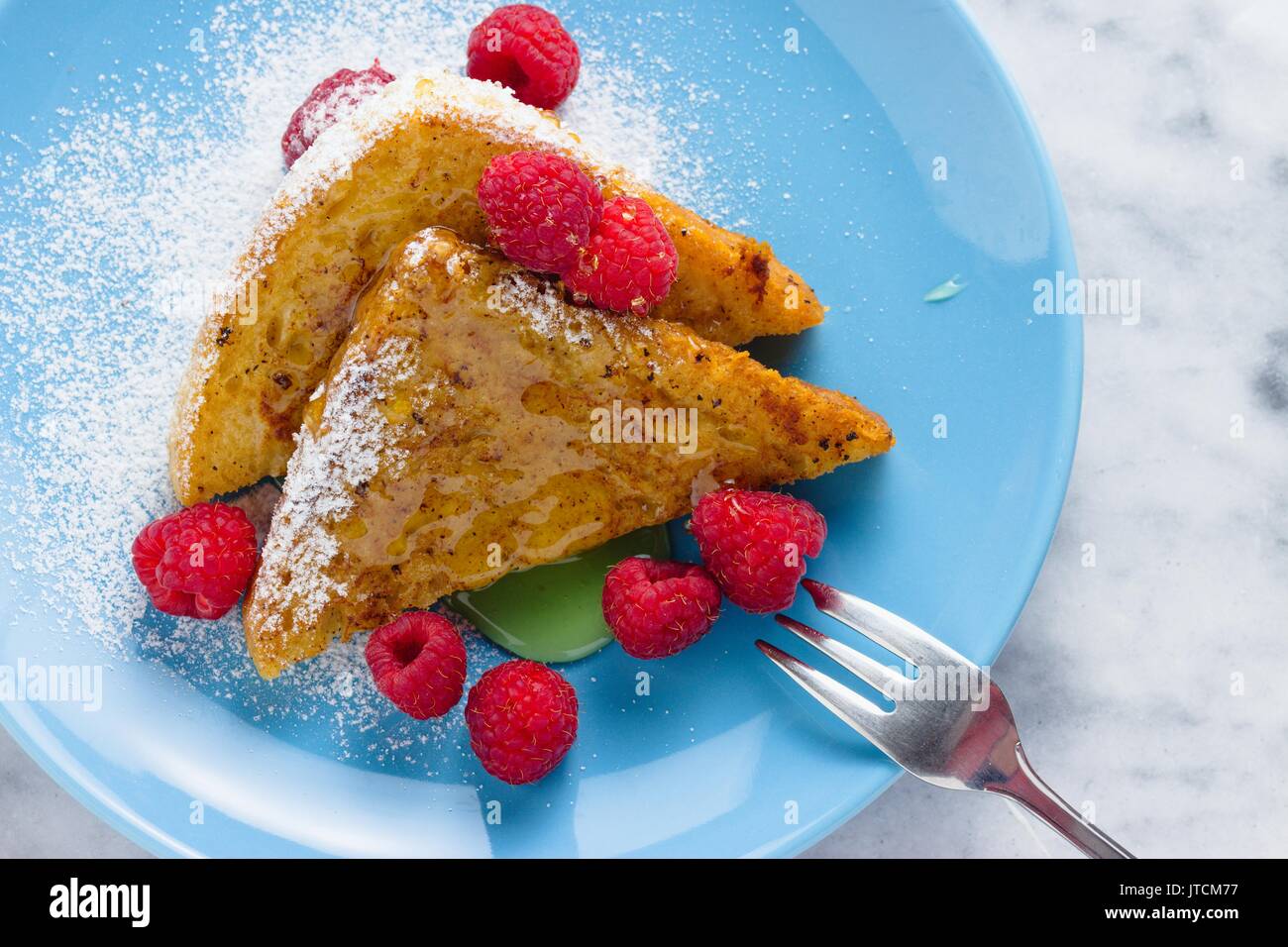 French toast with sugar,raspberries and honey, top down view Stock ...
