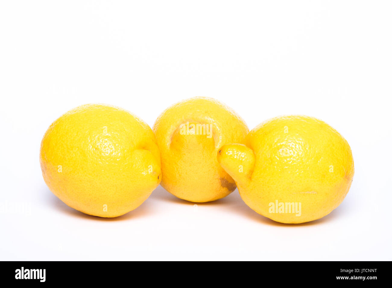 3 lemons on white background isolated Stock Photo - Alamy