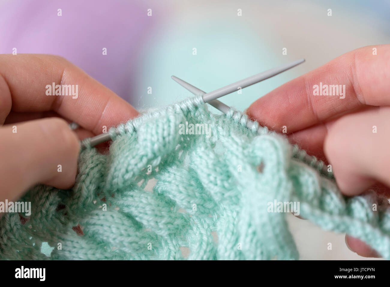 Hands of a master seamstress at work, knitting Stock Photo - Alamy