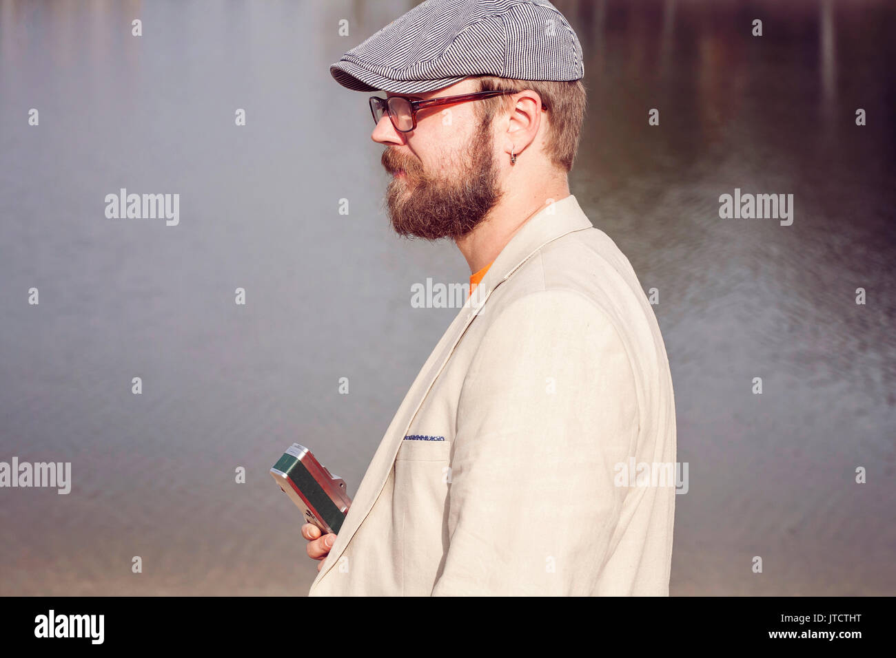 English style handsome man by the lake Stock Photo - Alamy