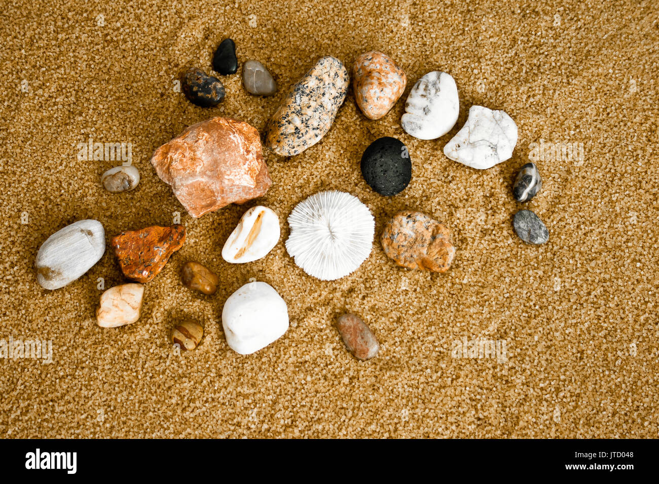 Multi-colored and variegated stones and small rocks gathered from the ...