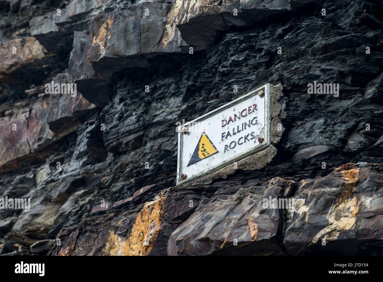Warning sign advising of falling rocks. Cornwall, England, United ...