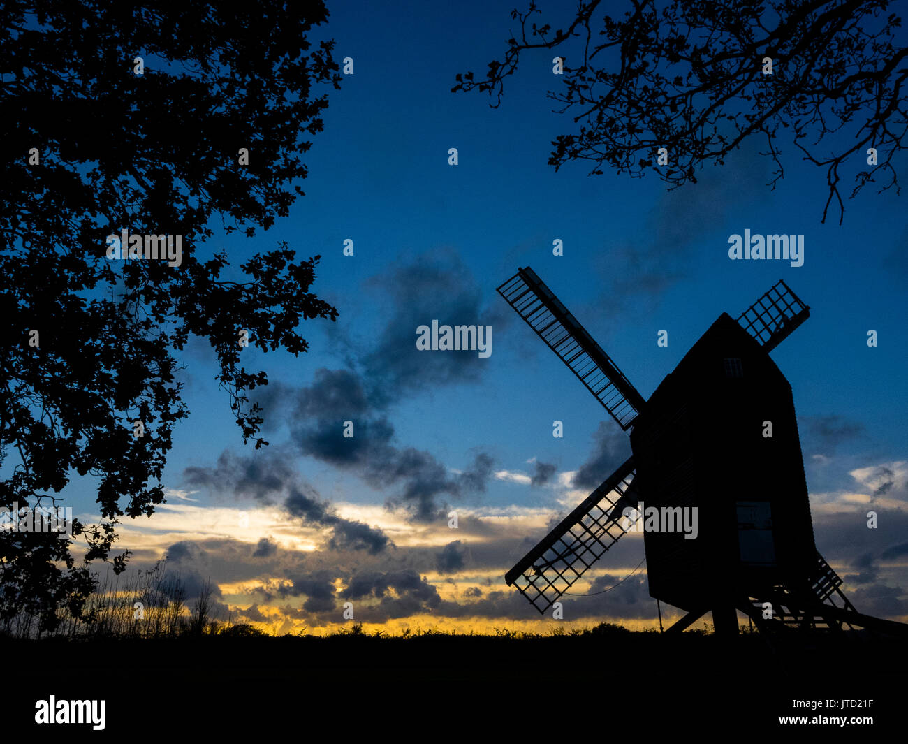 SUSSEX, ENGLAND Silhouette of Nutley Windmill as the sun sets over ...