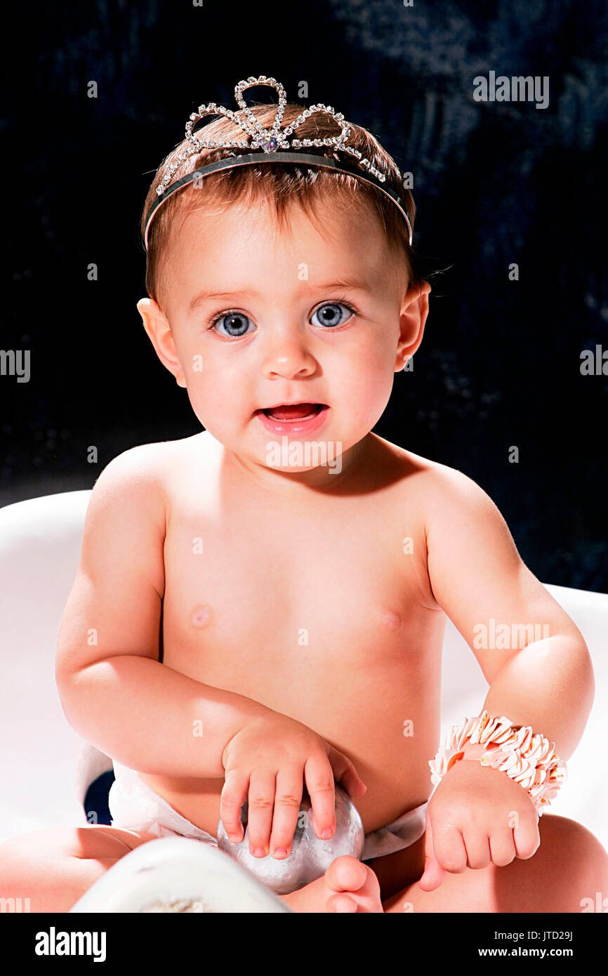 Baby, 8 months; smile; isolated, black background Stock Photo - Alamy