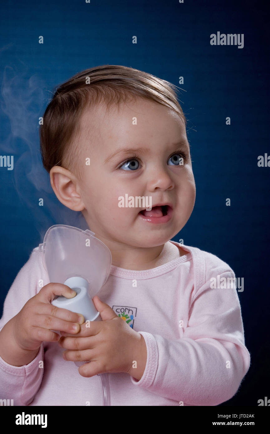 Baby, 8 months; Isolated, blue background Stock Photo - Alamy