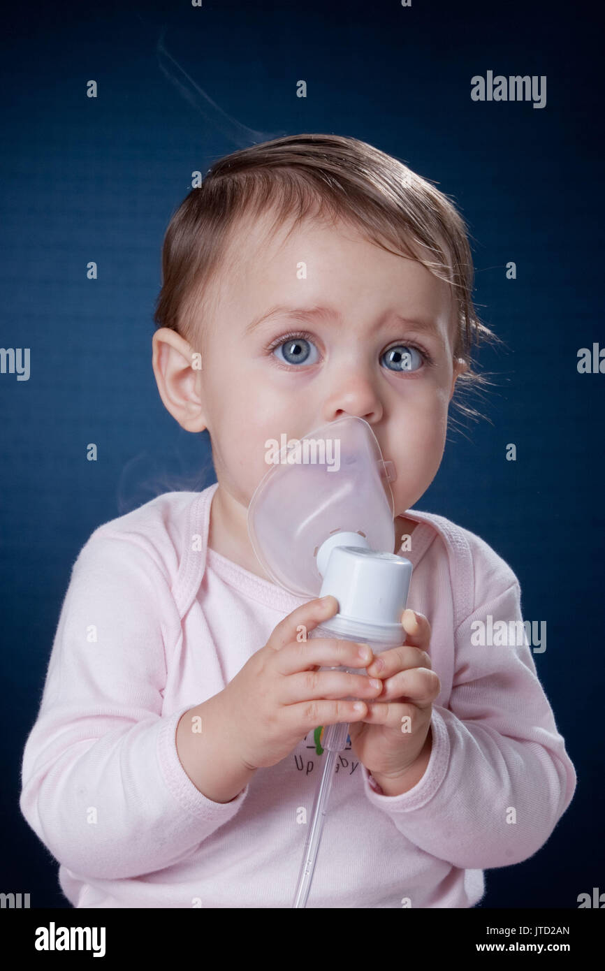 Baby, 8 months; Isolated, blue background Stock Photo - Alamy