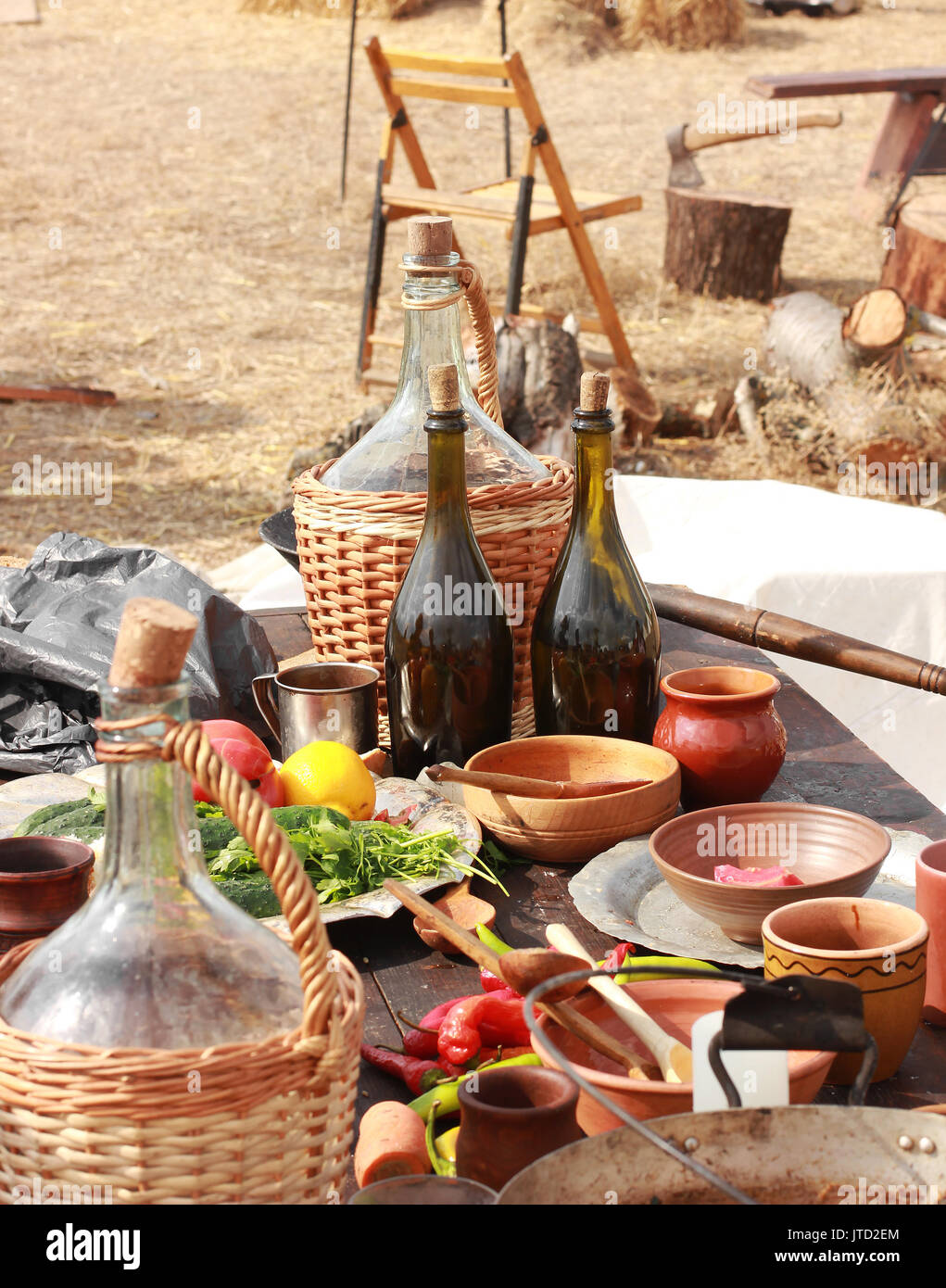 picnic table set with dishes and food Stock Photo - Alamy