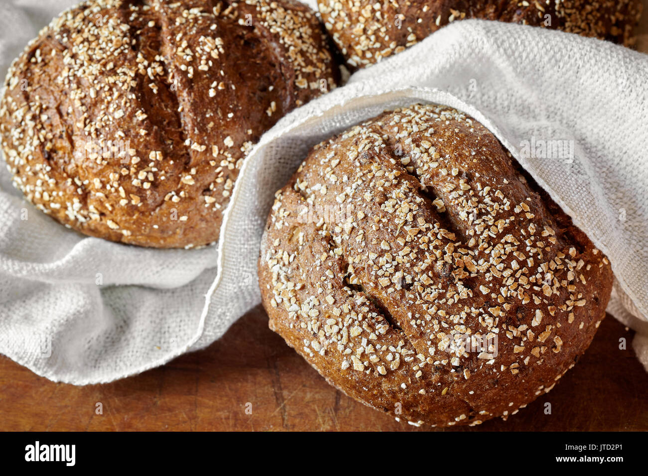 Closeup of wholemeal bread loafs with various seeds Stock Photo - Alamy