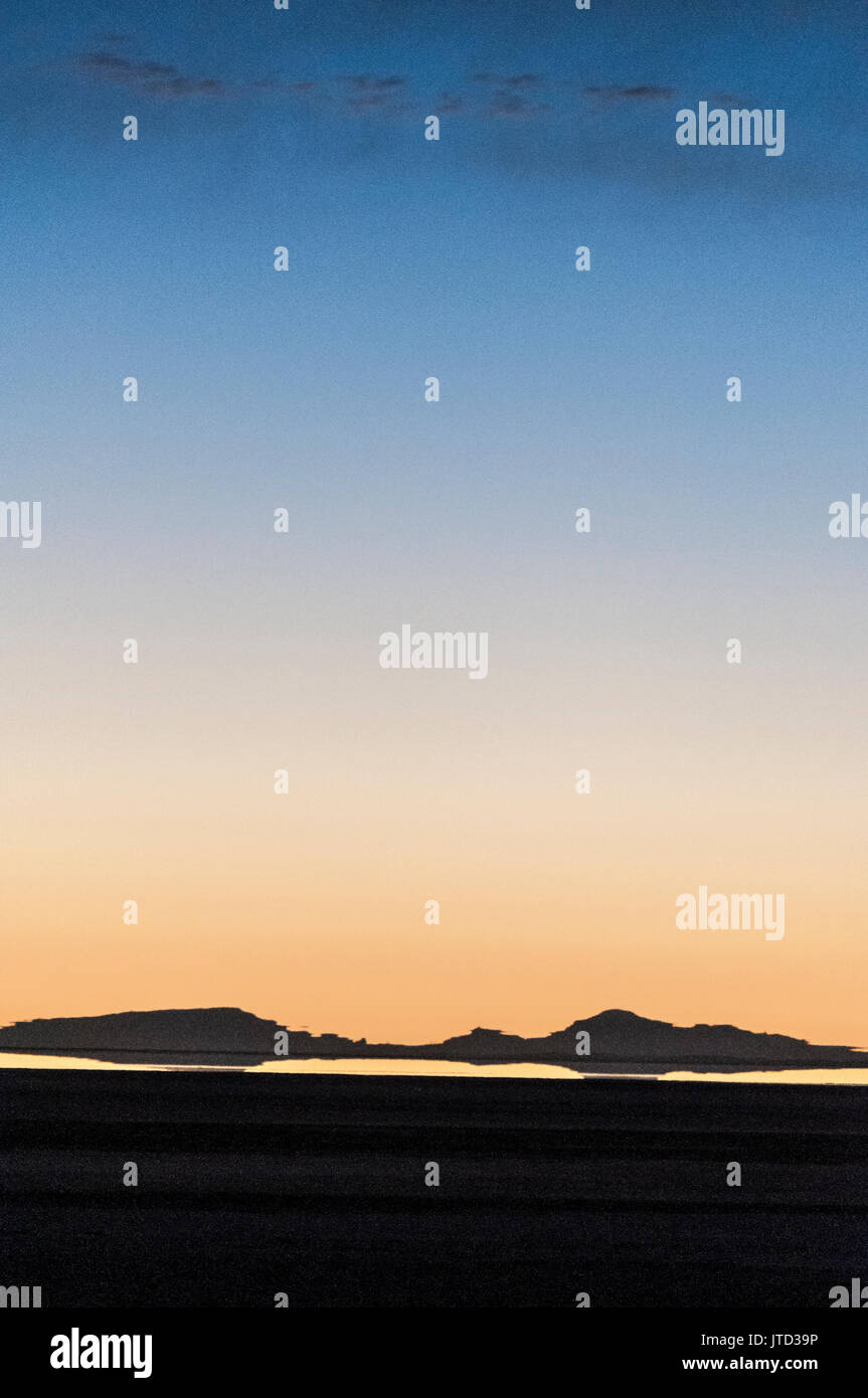 Salt Plains of Uyuni, Bolivia, glow at the crack of dawn Stock Photo ...