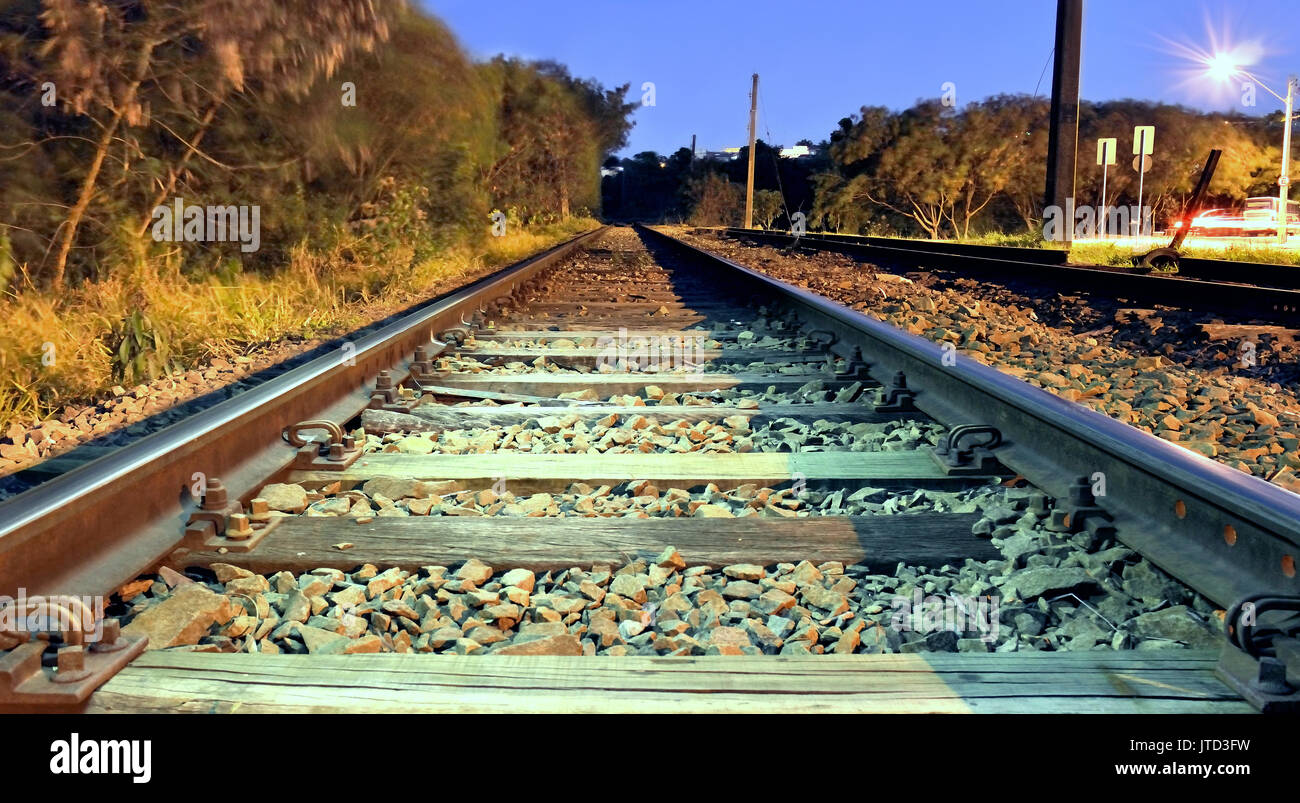 Empty Railroad track at night Stock Photo - Alamy