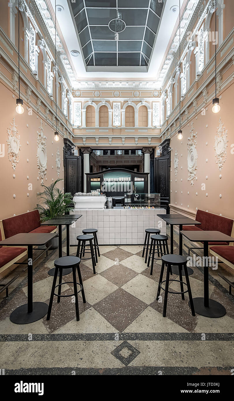 Luminous coffee zone in the antique restaurant with white stucco ...