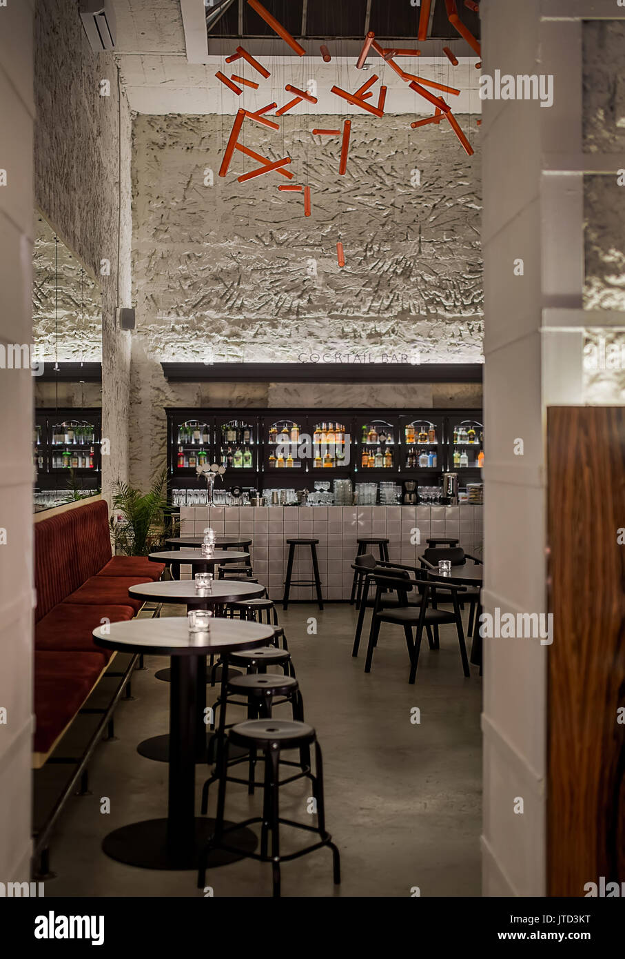 Glowing bar with textured walls and a large window on the ceiling ...