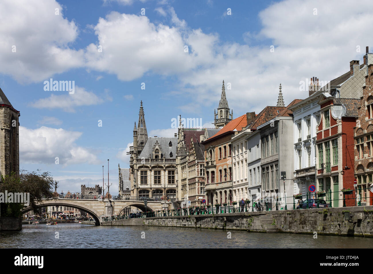 The historical buildings and a bridge over Lys river in Ghent, Belgium ...