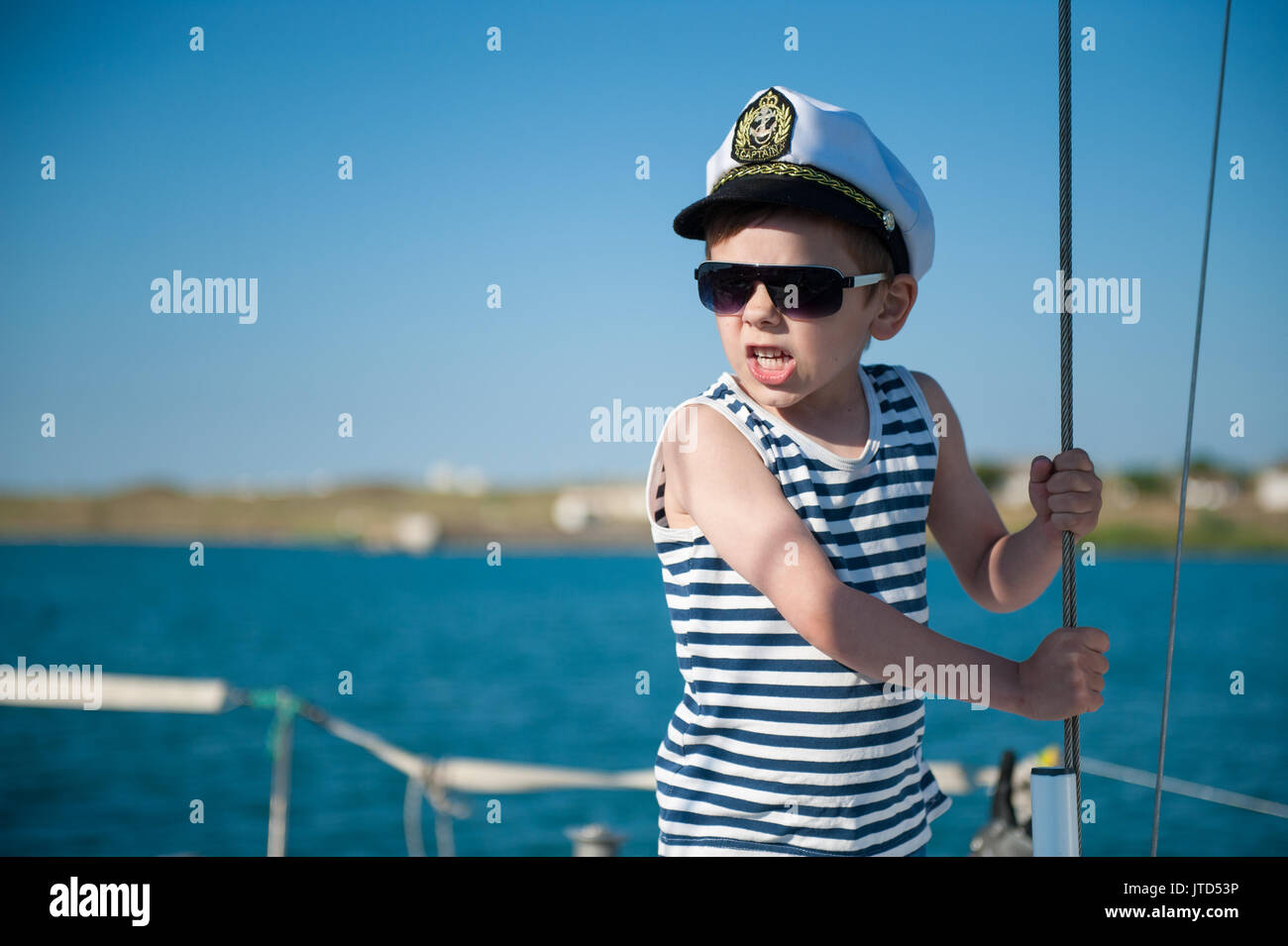 angry little boy captain shouting orders aboard vessel Stock Photo - Alamy