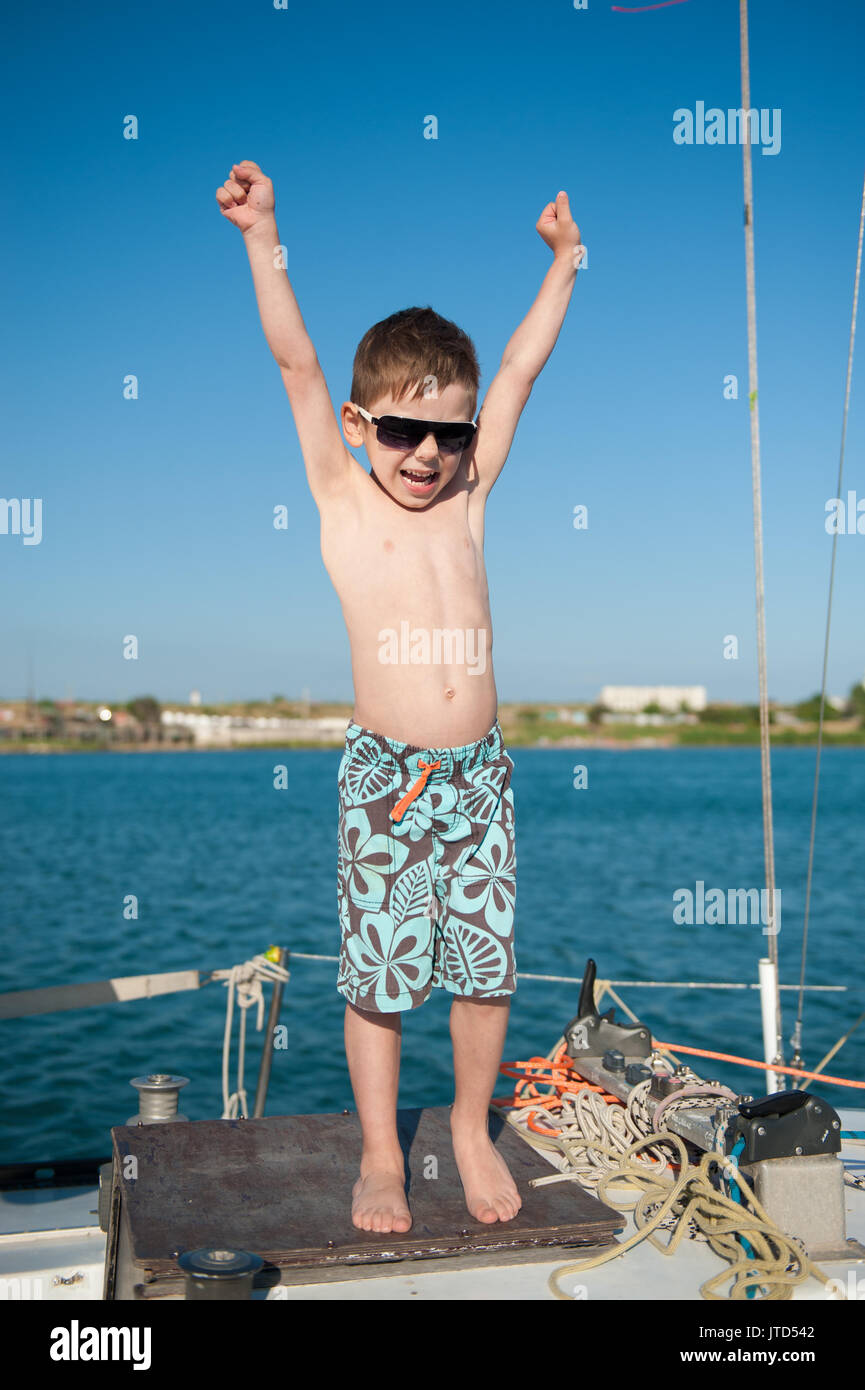 happy healthy cute child raising his hands up with happiness Stock ...