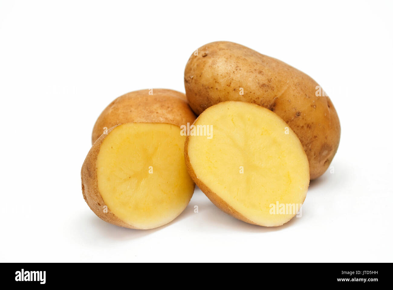 Three potatoes isolate on a white background Stock Photo - Alamy