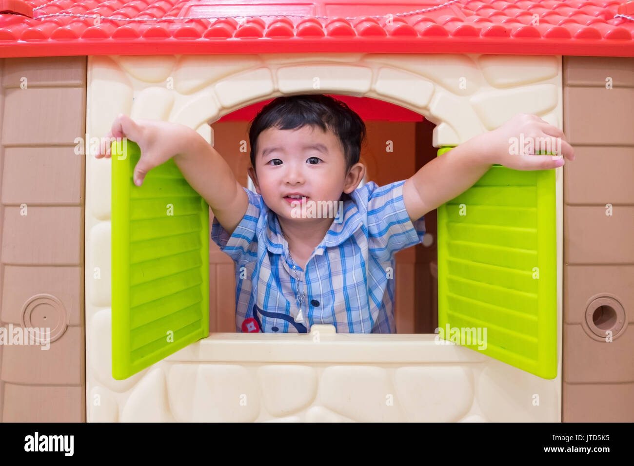 Happy Asian child Boy playing with window toy house and smiling in ...