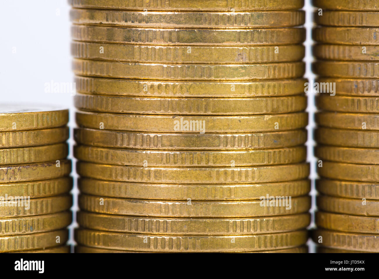 Columns of gold coins, piles of coins arranged isolated on white ...