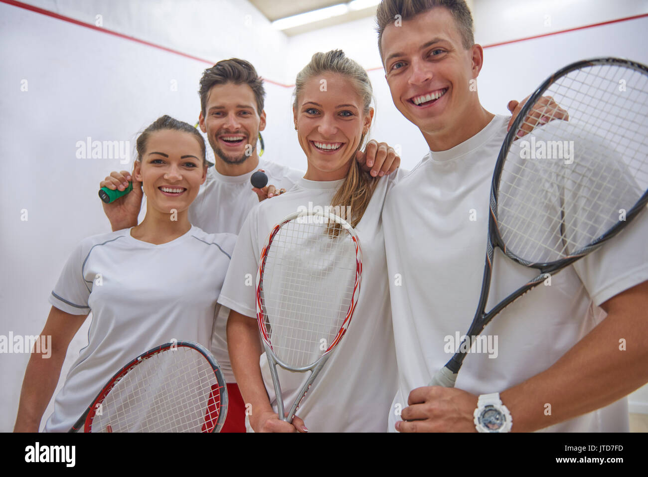 Very successful team at a squash court Stock Photo - Alamy