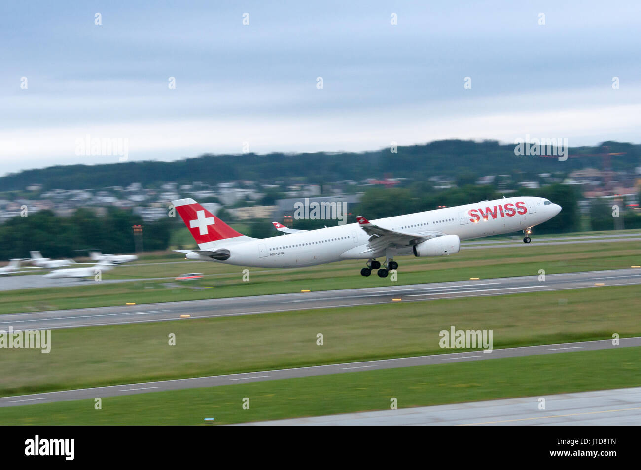 Swiss Airlines plane landing in Zurich early in the morning Stock Photo ...