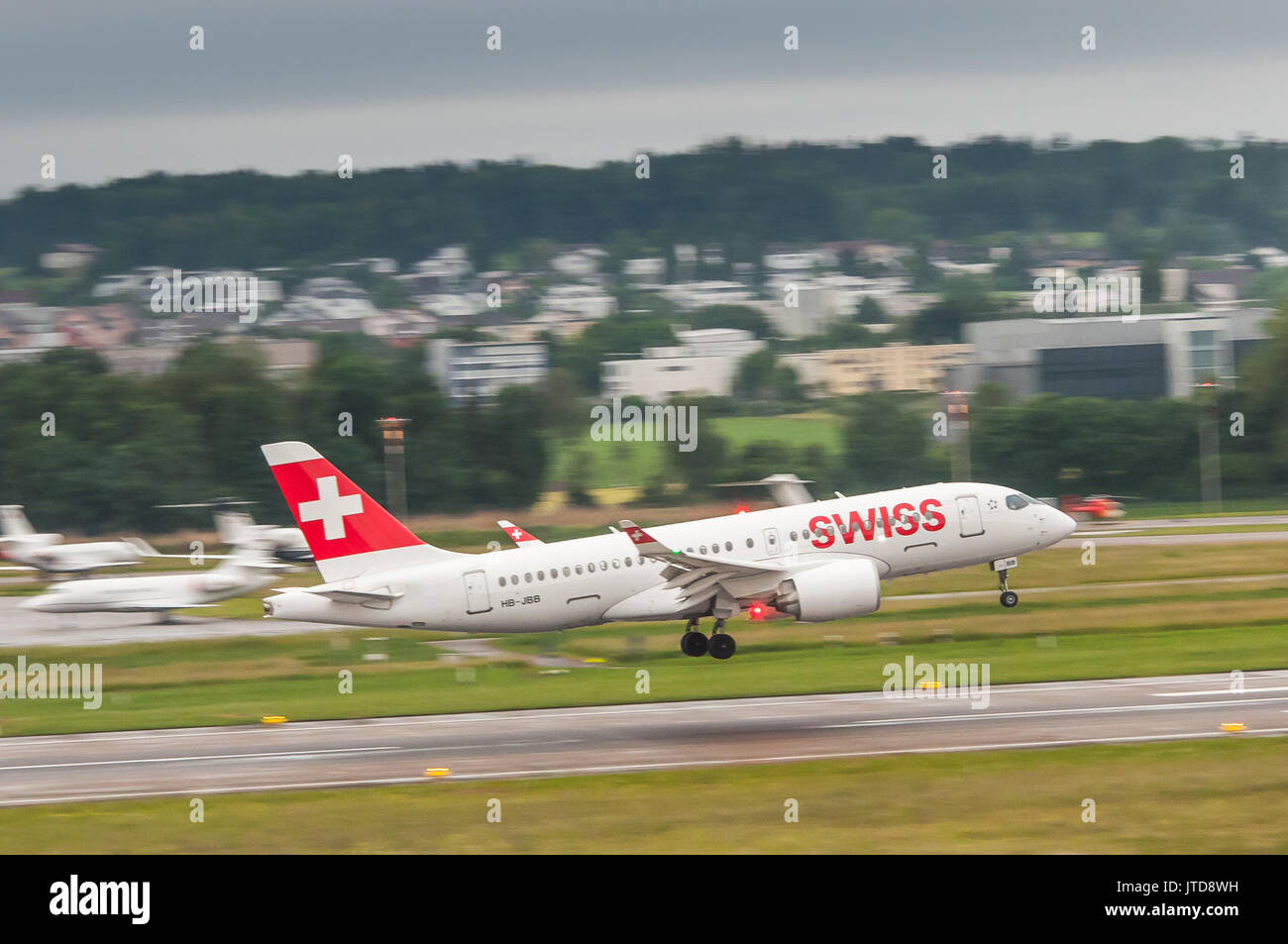 Swiss Airlines plane landing in Zurich early in the morning Stock Photo ...