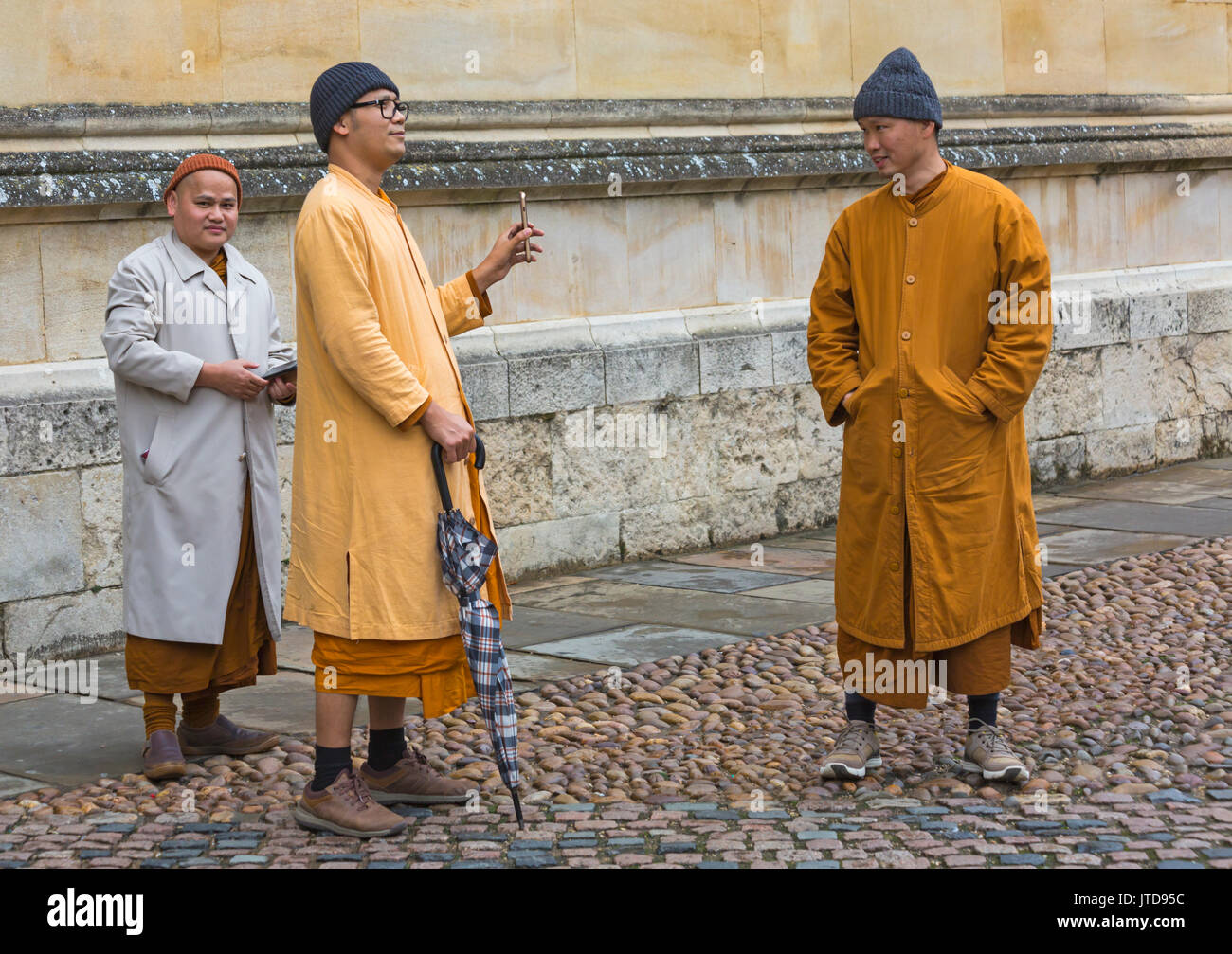 Buddhist monks in their robes, coats and hats visiting Oxford ...
