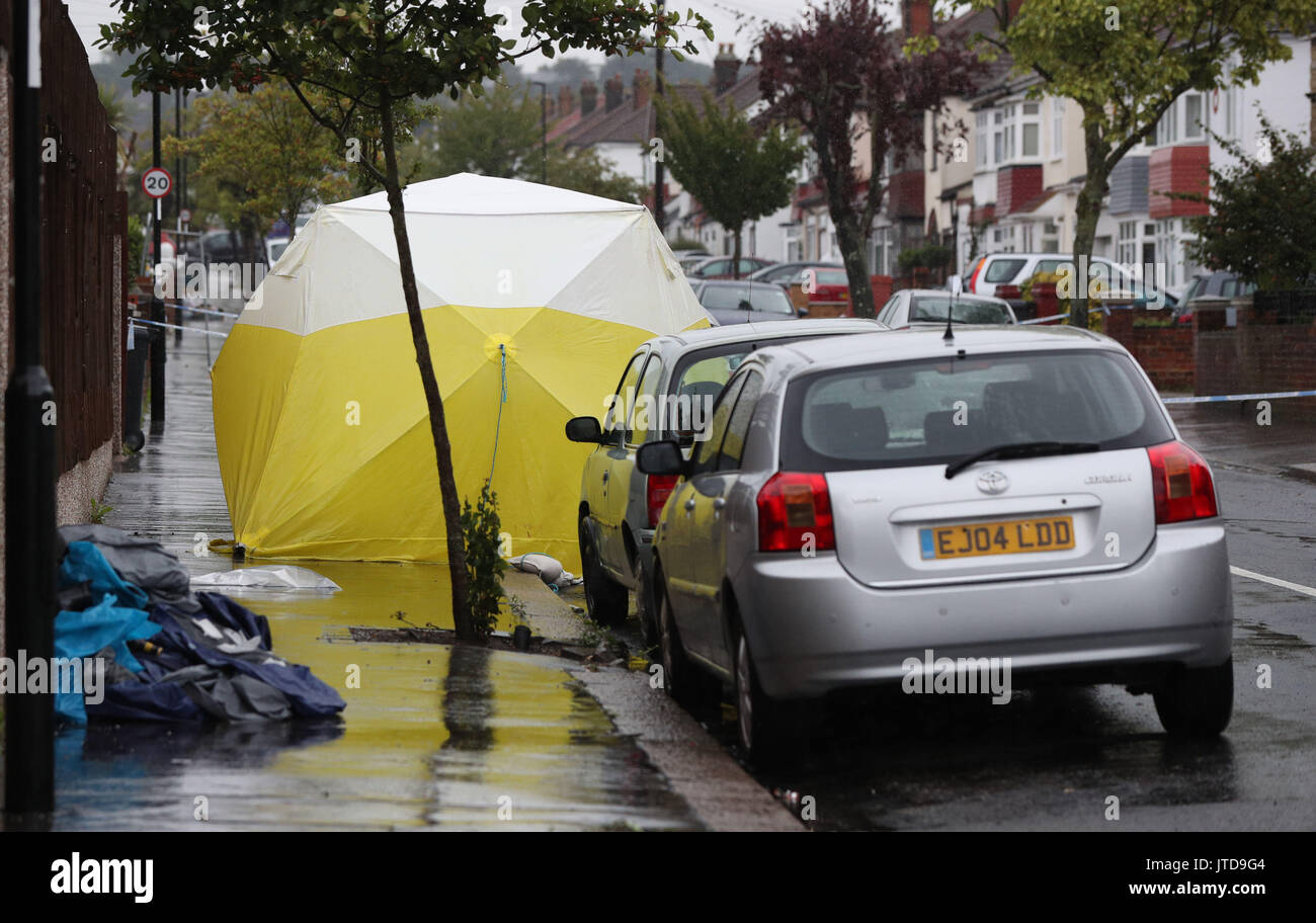 A police forensics tent at the scene in Thornton Heath, south London ...