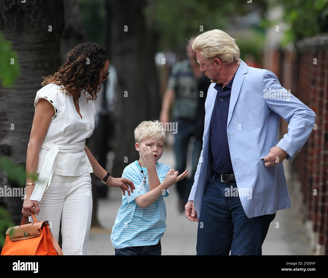 Well dressed Boris Becker and Lilly Becker take their son Amadeus on a ...