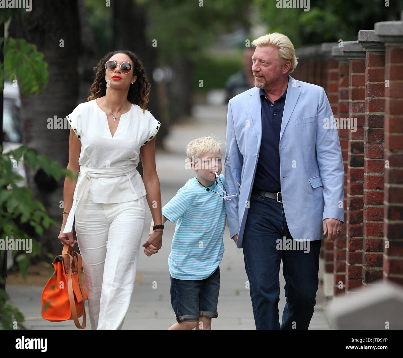 Well dressed Boris Becker and Lilly Becker take their son Amadeus on a ...