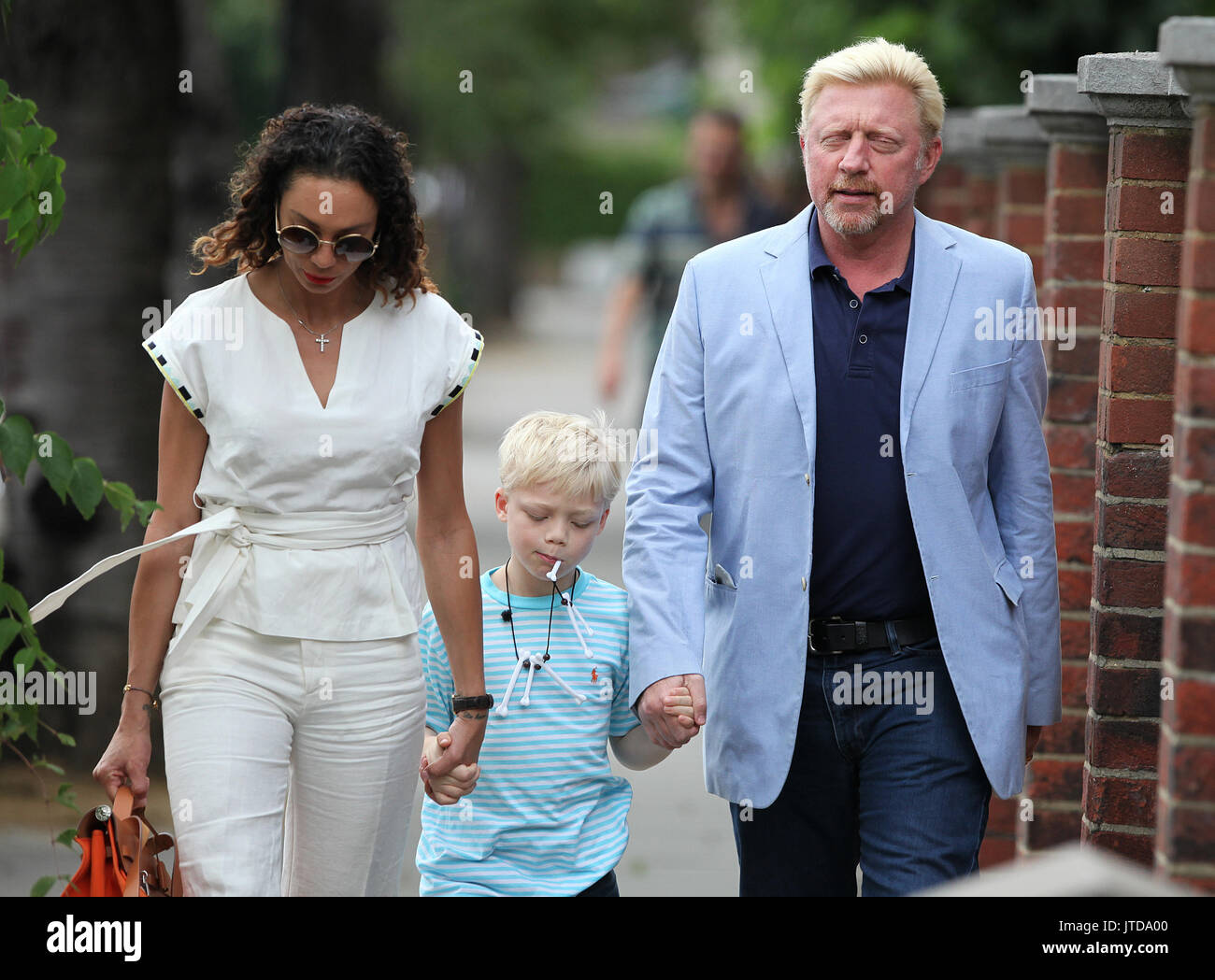 Well dressed Boris Becker and Lilly Becker take their son Amadeus on a ...