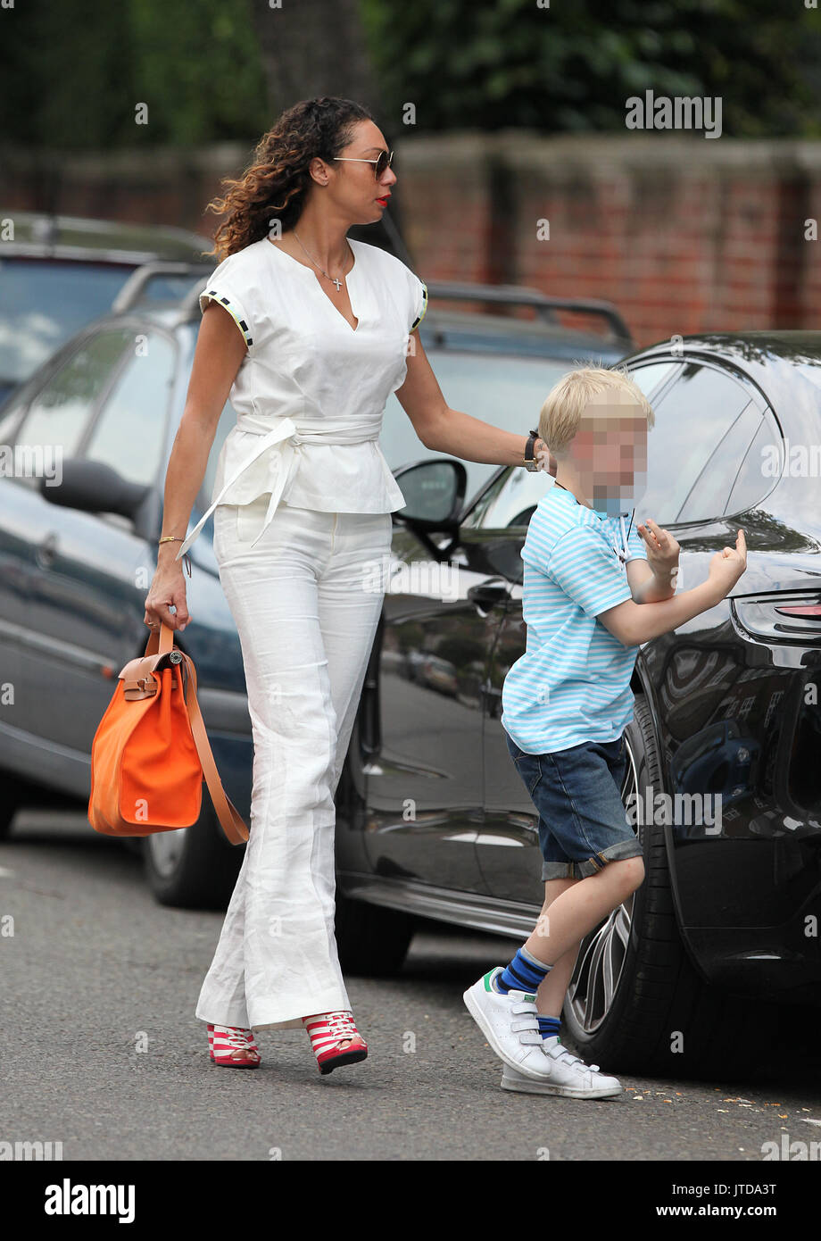 Well dressed Boris Becker and Lilly Becker take their son Amadeus on a ...