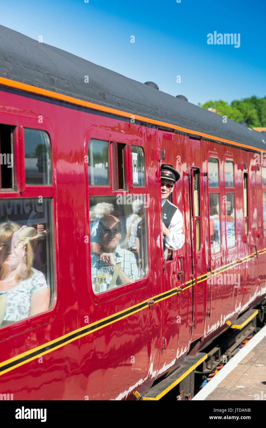 The guard of a special train hauled by ex-LNER locomotive No.60103 ...