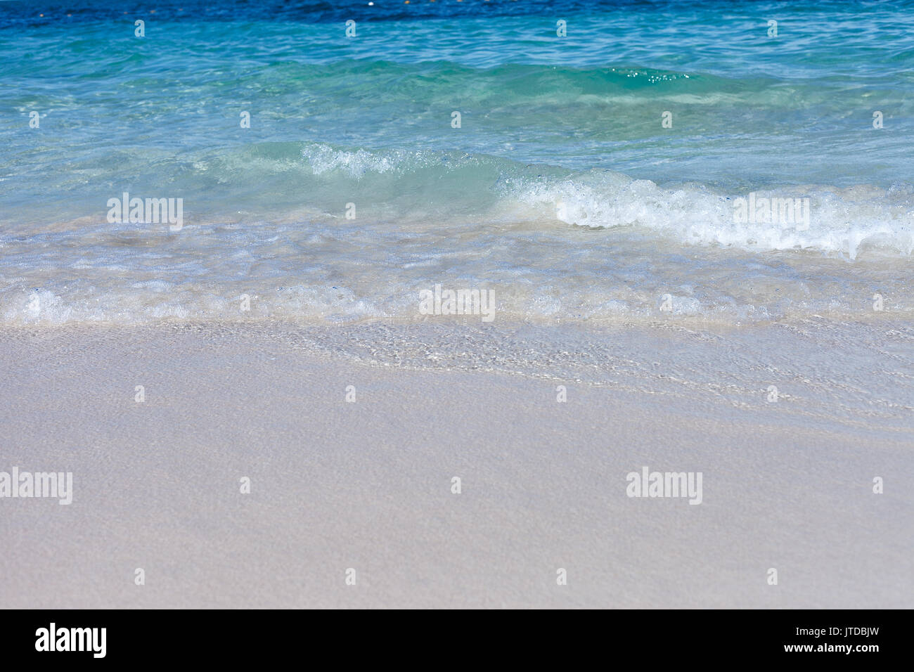 Soft Wave Of Blue Ocean On Sandy Beach. Background. Selective focus ...