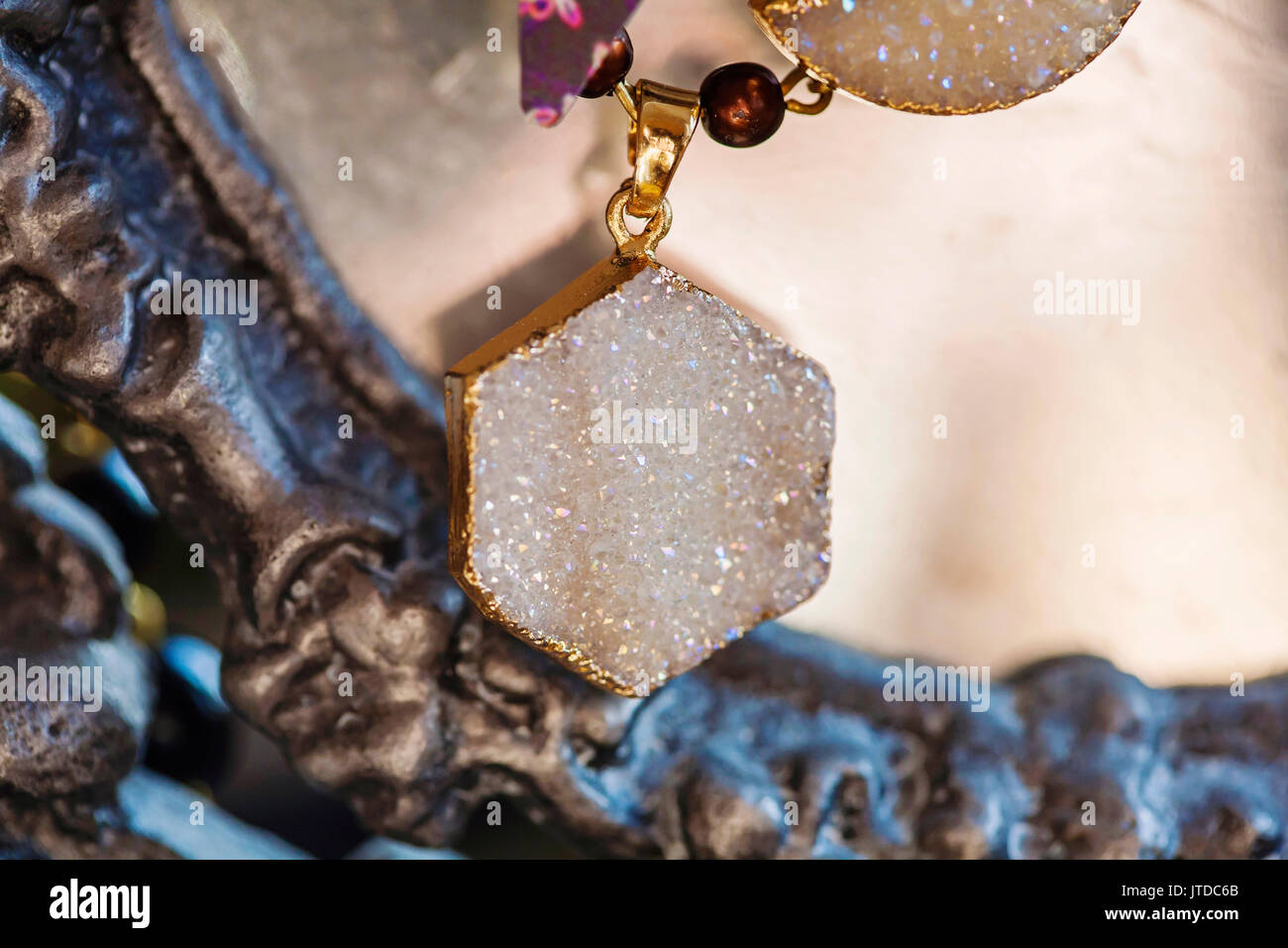 Beautiful natural stone pendant in hexagon shape Stock Photo - Alamy