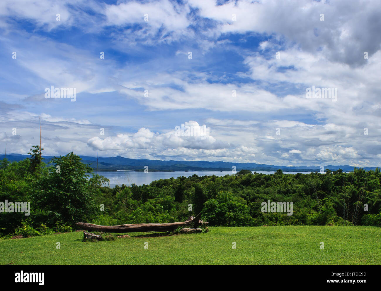 beautiful garden in front of blue Srinakarin dam with clear blue sky ...