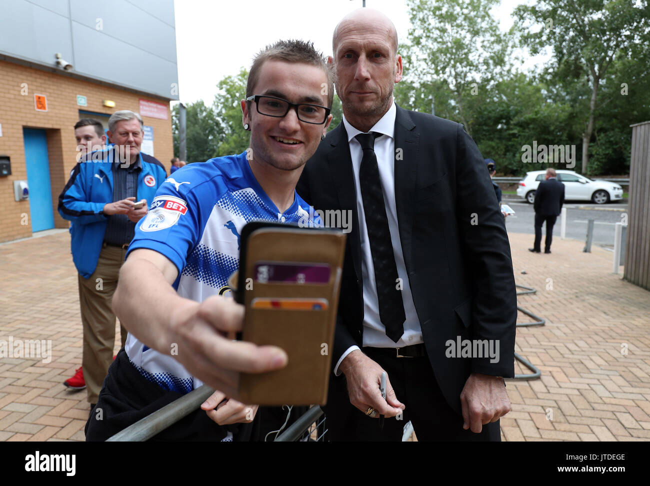 Reading manager Jaap Stam (right) poses for a photograph with a fan ...