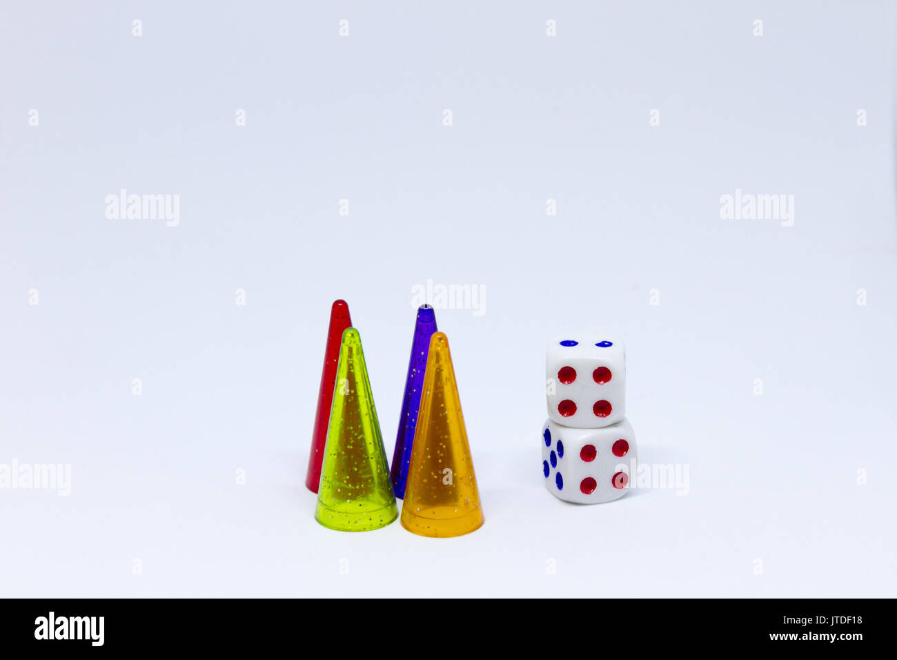 Multi-colored plastic parts (accessories) for a game of dice, isolated ...