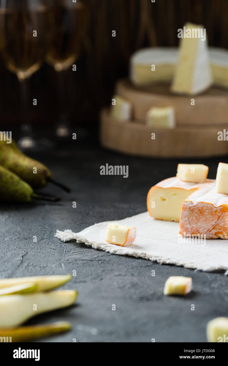 French soft cheese from Brittany region and brie sliced, with pear ...