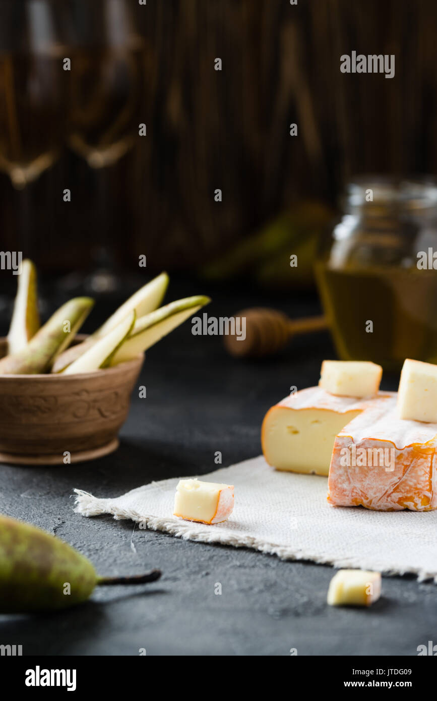 French soft cheese from Brittany region and sliced brie with pear ...