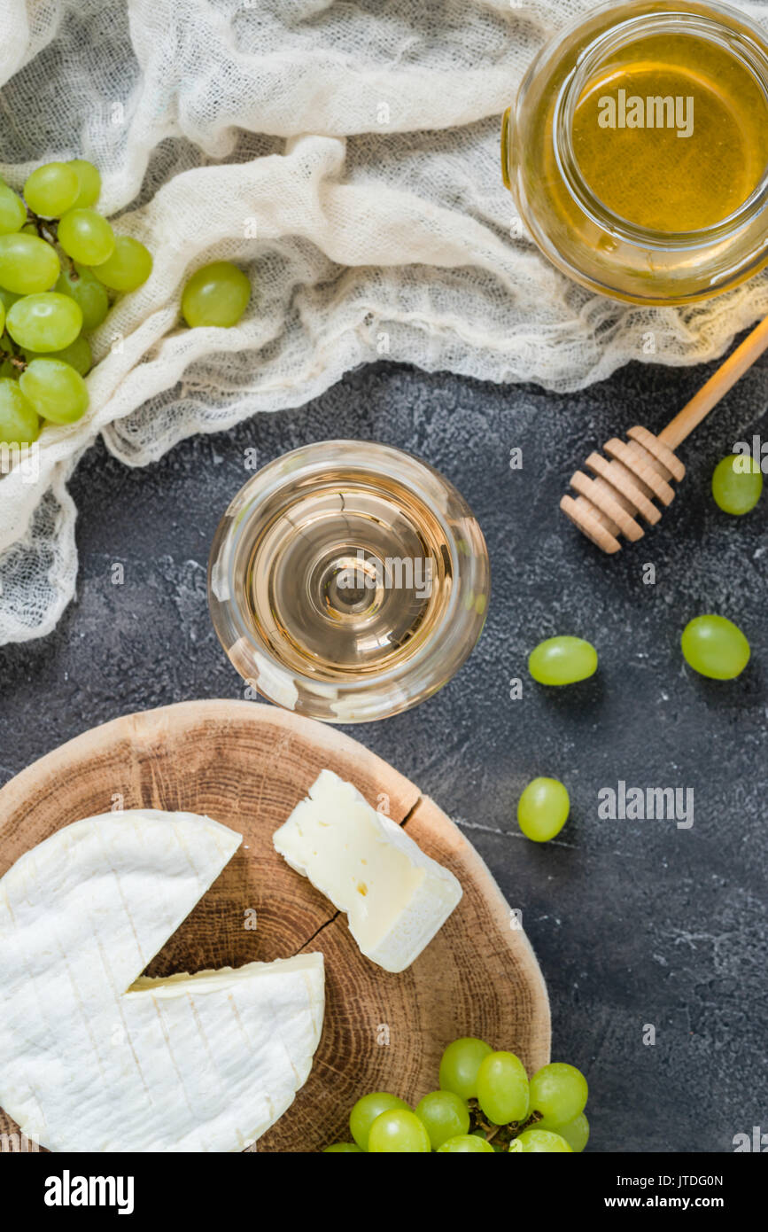 French soft cheese from Normandy region sliced on a wooden cut with ...