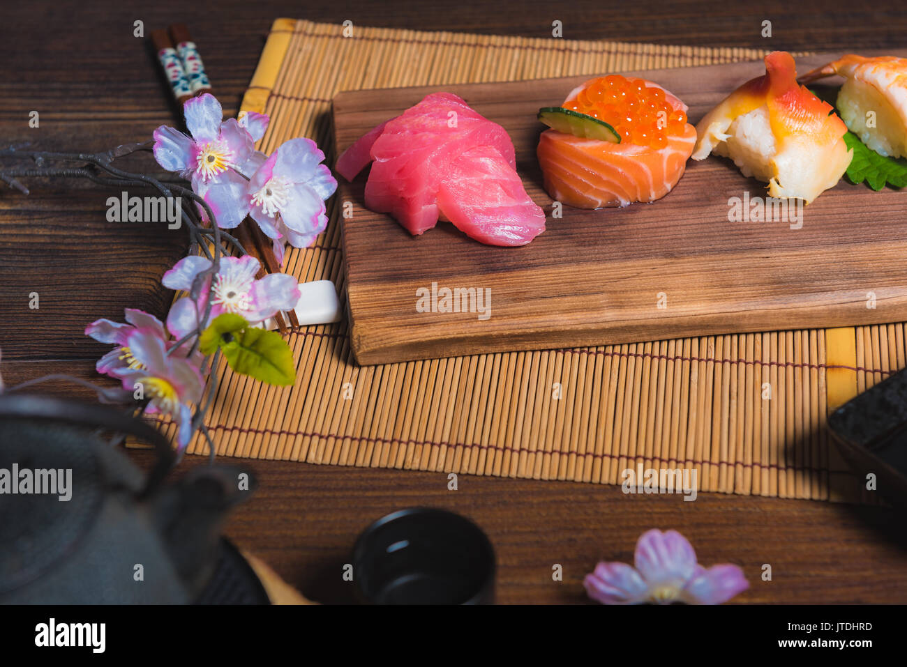traditional Japanese cuisine. Process of eating sushi rolls or sushi ...