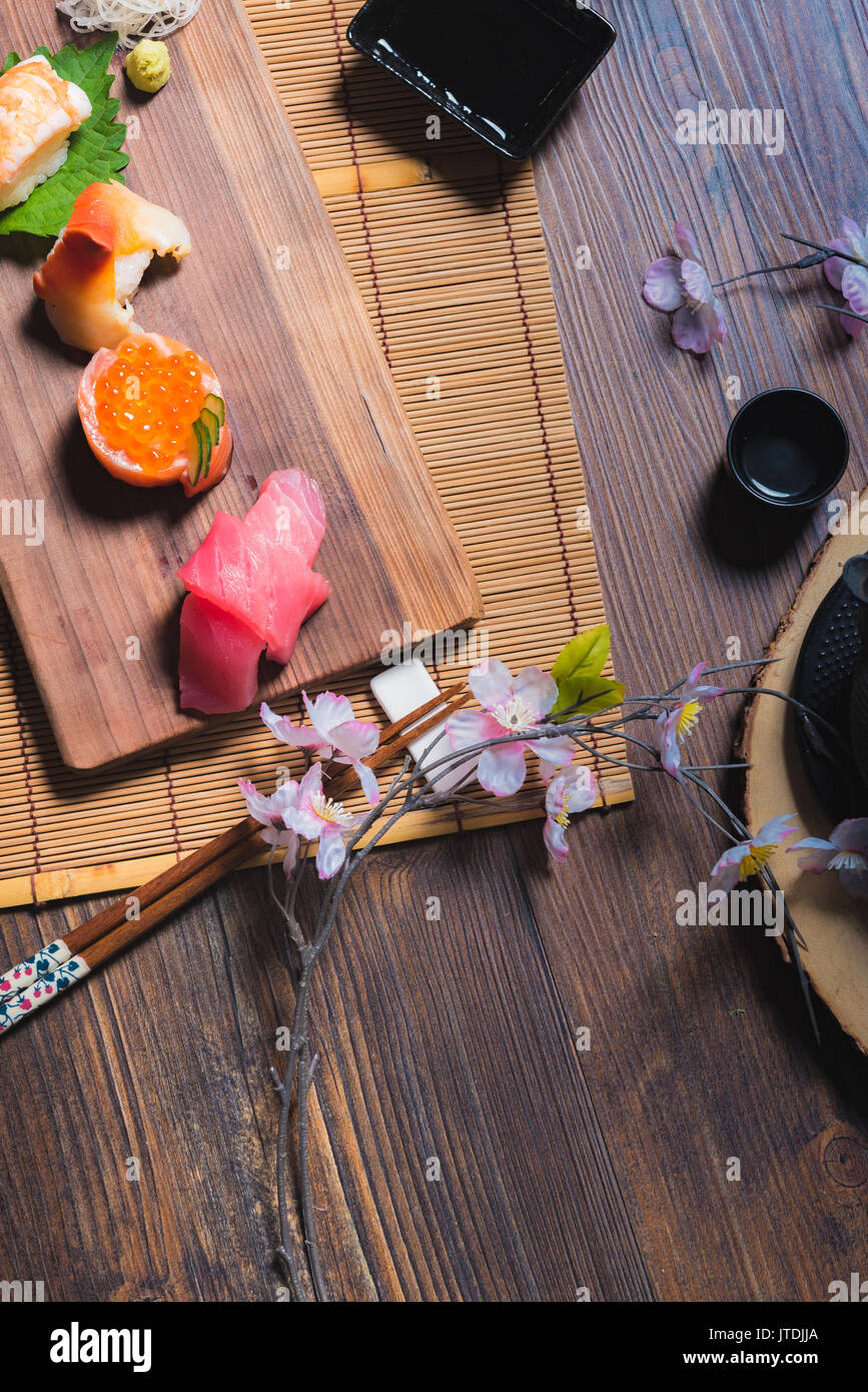 traditional Japanese cuisine. Process of eating sushi rolls or sushi ...