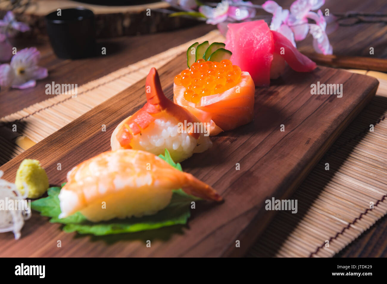 traditional Japanese cuisine. Process of eating sushi rolls or sushi ...